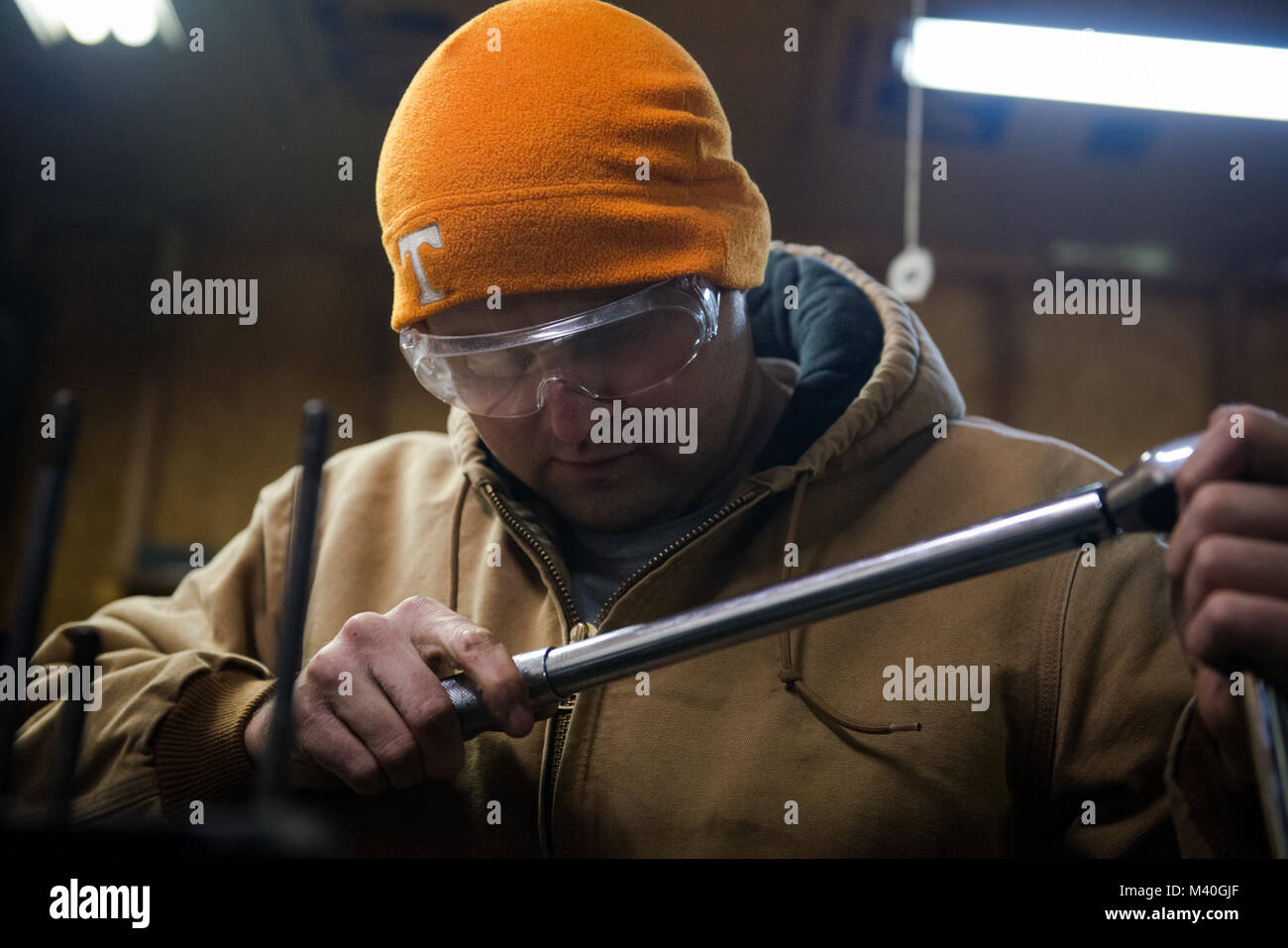 Master Sgt. Randy Rollins tunes the settings on his torque wrench to ...