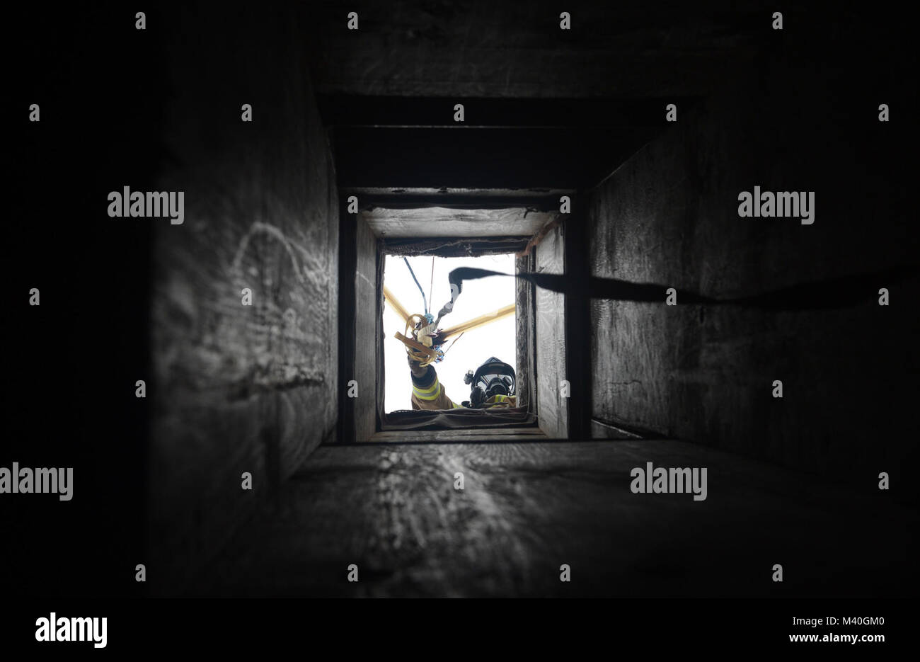 A firefighter with the 86th Civil Engineering Squadron checks a pulley ...