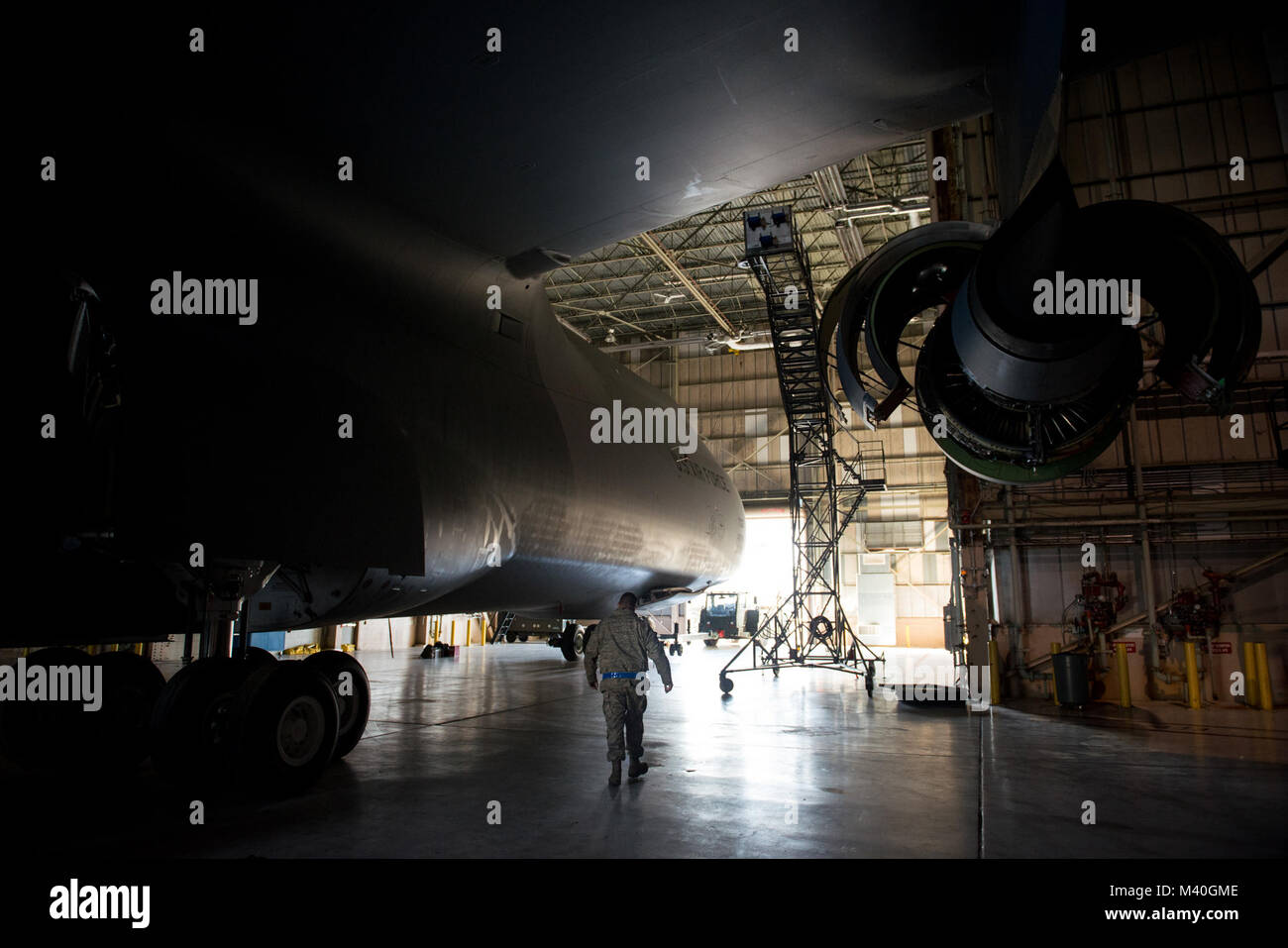 Master Sgt. Randy Rollins leaves a C-5 Galaxy hangar after checking the ...