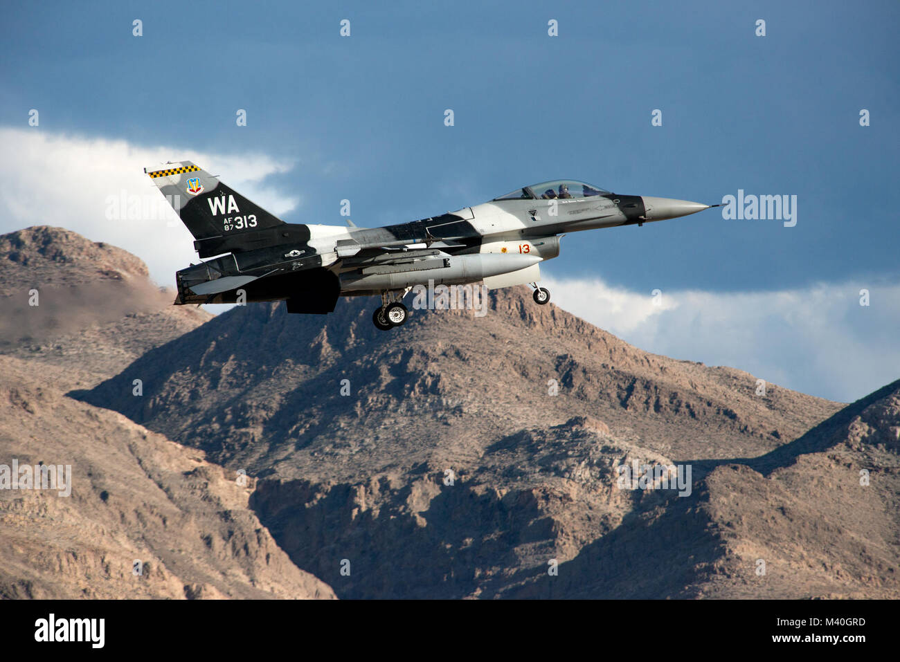 An F-16 Fighting Falcon from the 64th Aggressor Squadron approaches ...