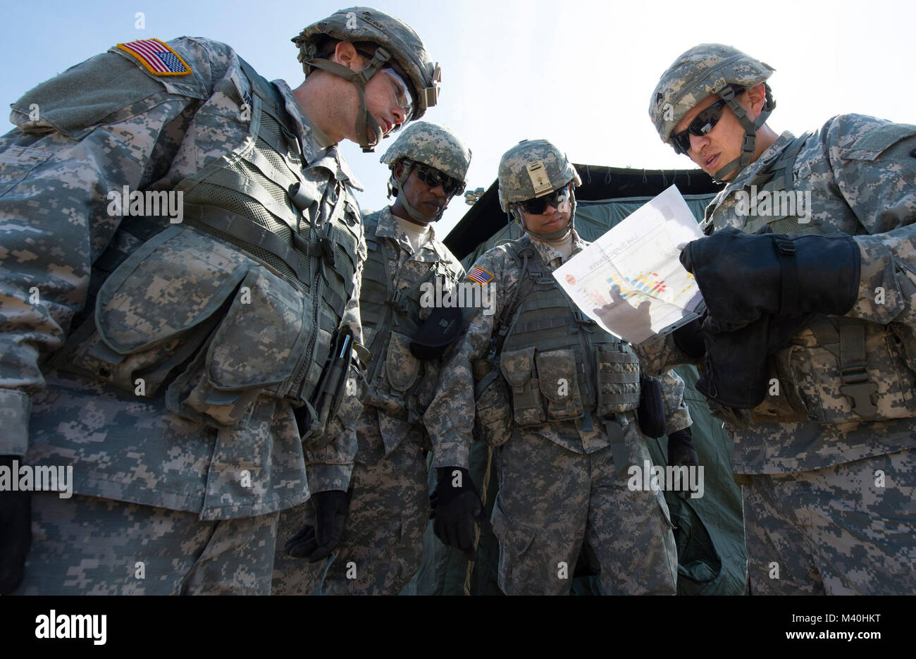Members of the 212th Combat Support Hospital (CSH) build a fully ...