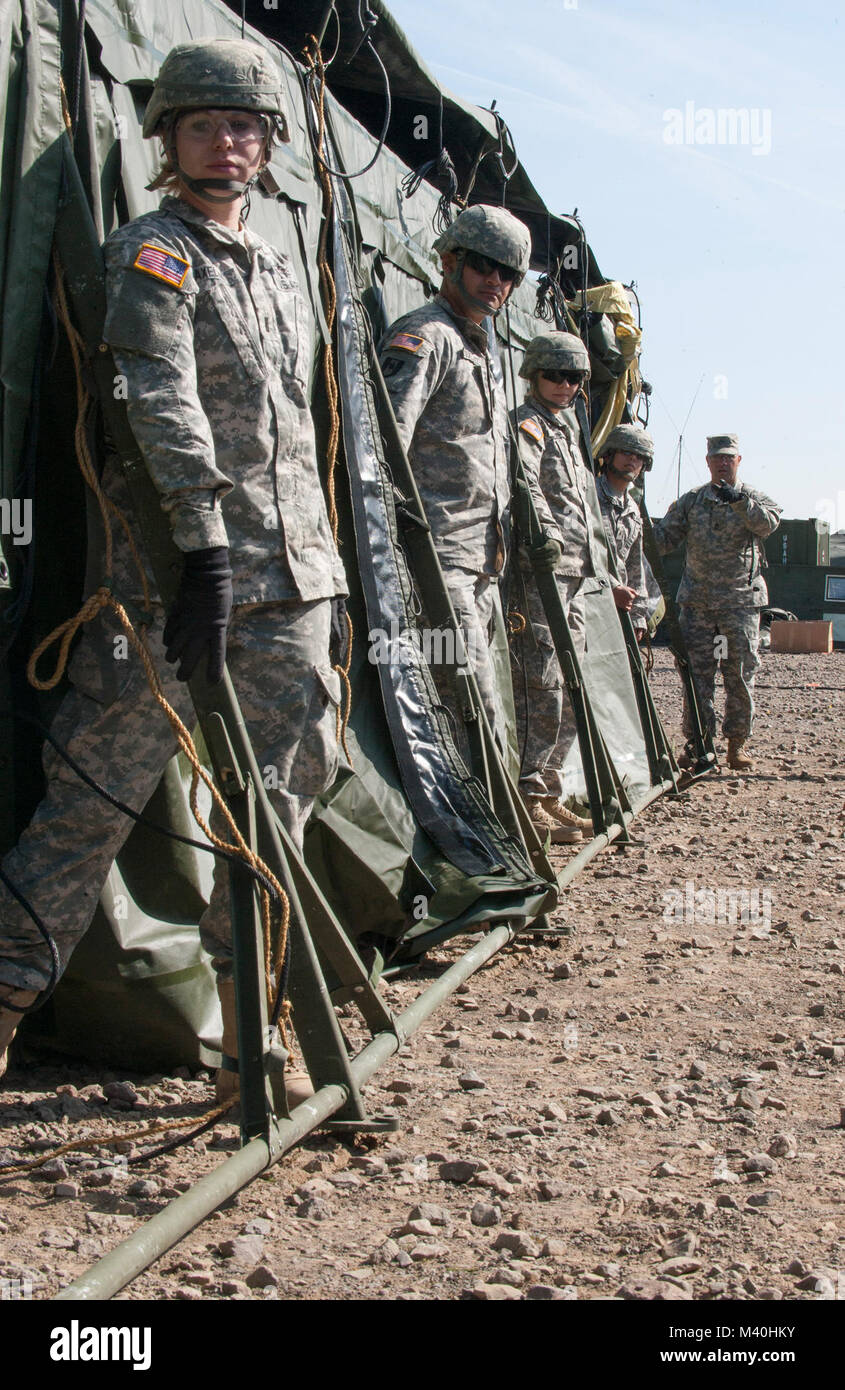 Members of the 212th Combat Support Hospital (CSH) build a fully ...