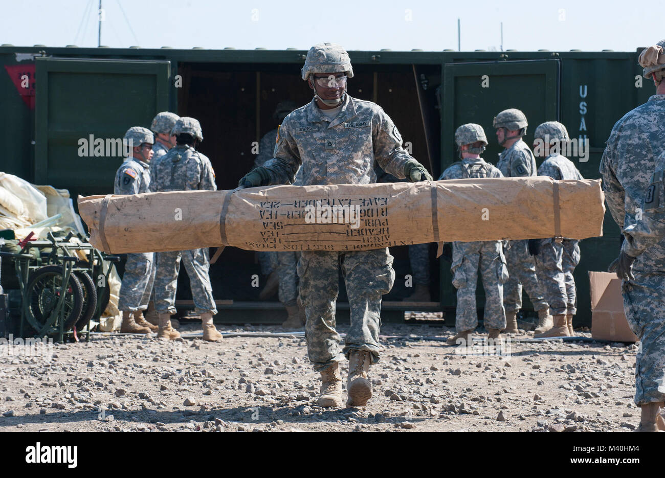 Members of the 212th Combat Support Hospital (CSH) build a fully ...