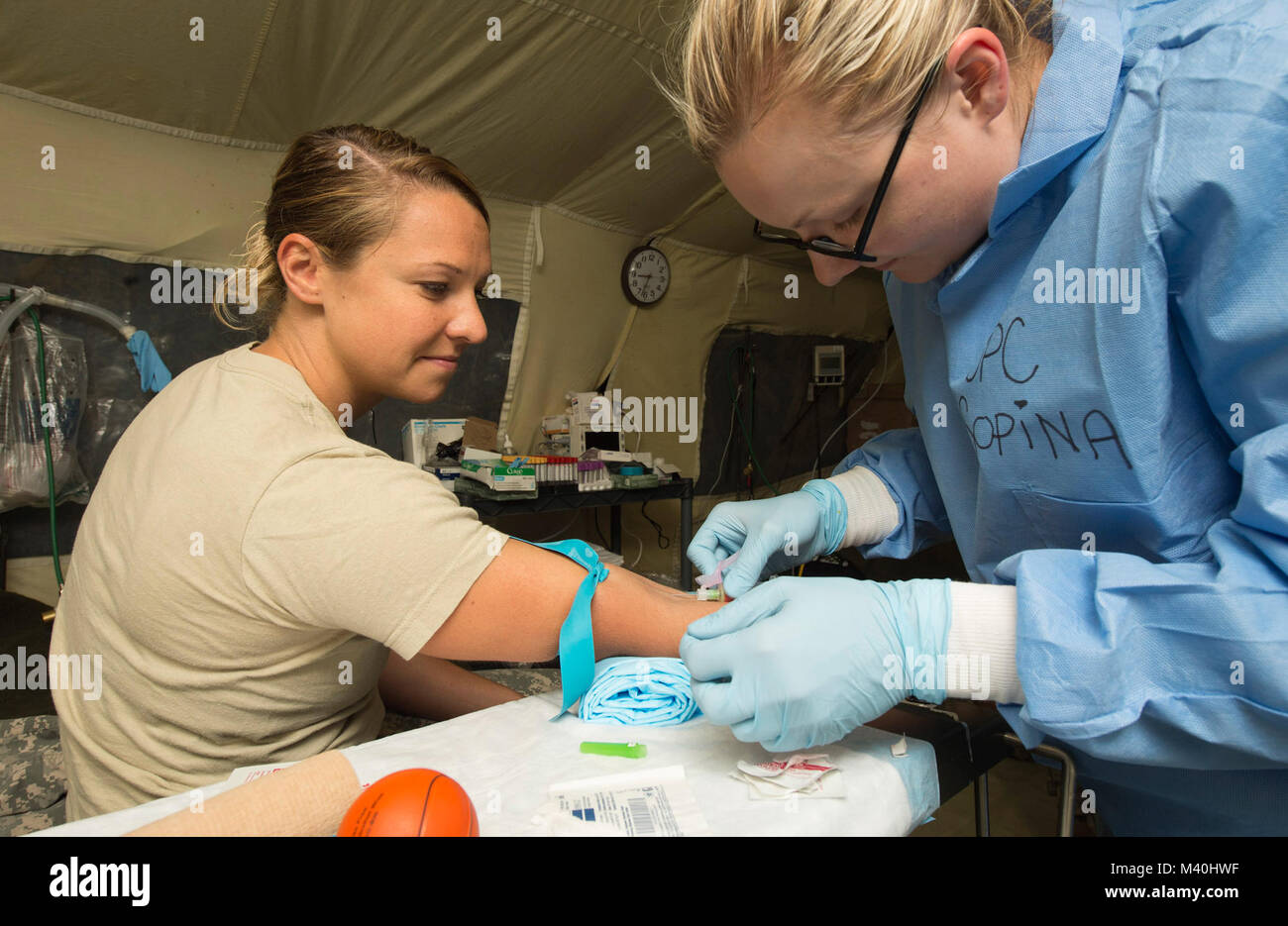 U.S. Army Captain Britany Book (left), an Intensive Care Unit (ICU ...