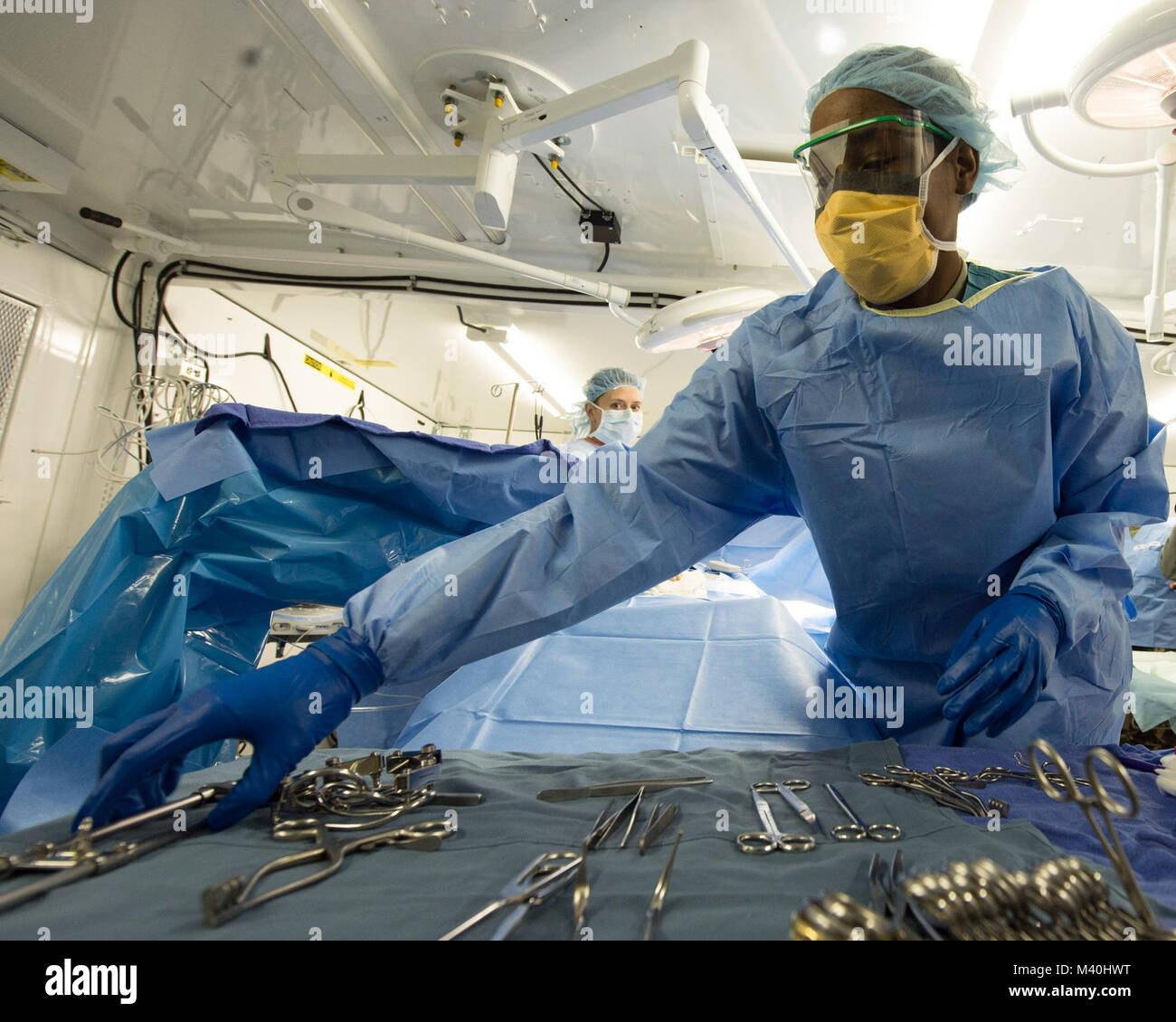 U.S. Army Private First Class Charlisea Rogers (right), a surgical ...