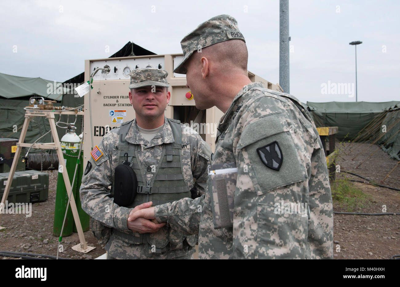 U.S. Army Staff Sergeant Nicholas Mariott (left), a respiratory ...