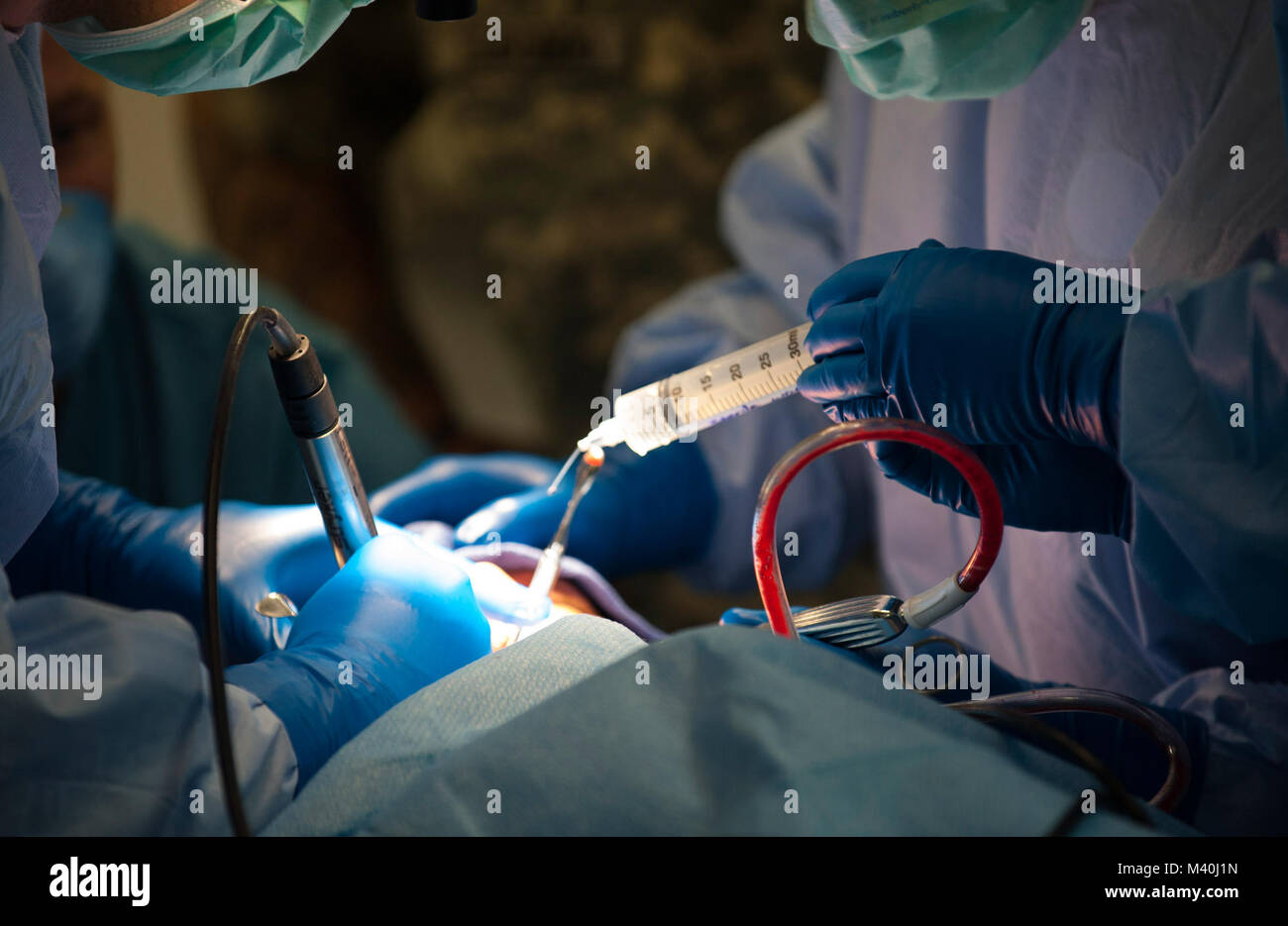 A patient receives oral surgery during a 212th Combat Support Hospital ...