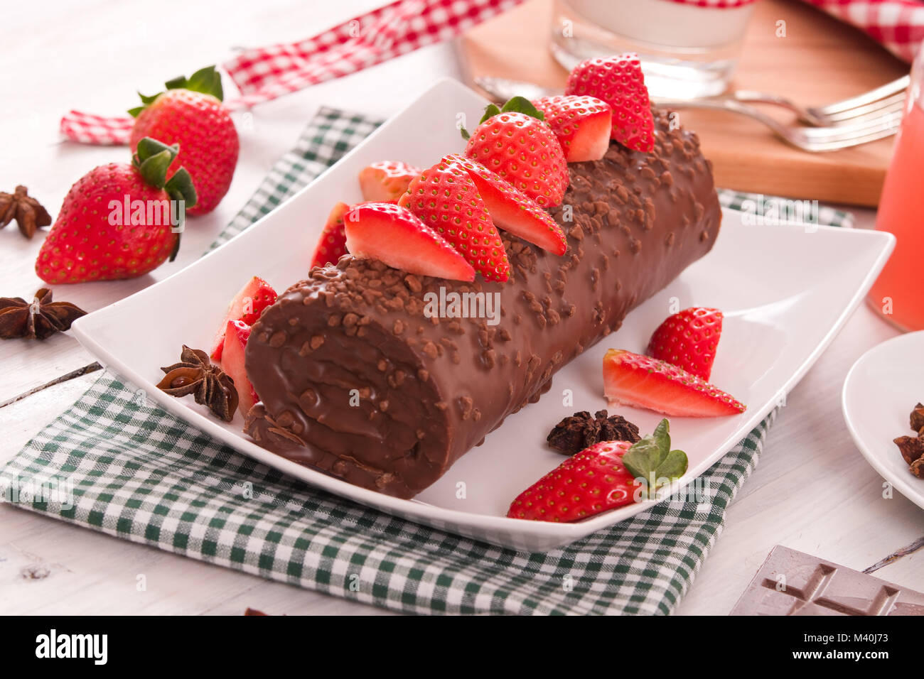 Chocolate roll with strawberries Stock Photo - Alamy