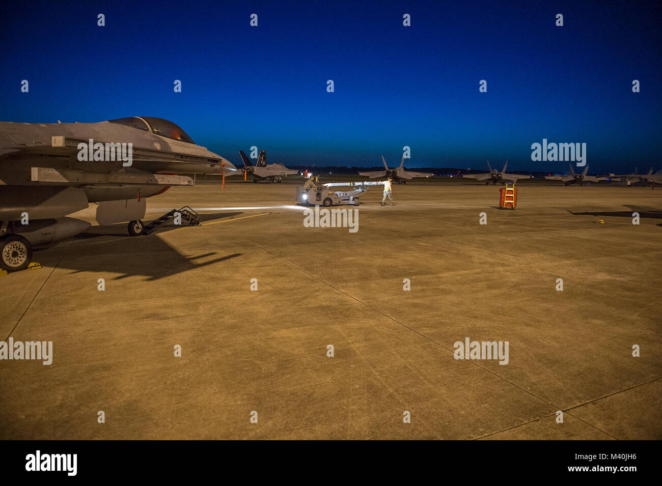 Staff Sgt. Kelly Eilenberg (walking) and Senior Airman Jonathan Bybee ...