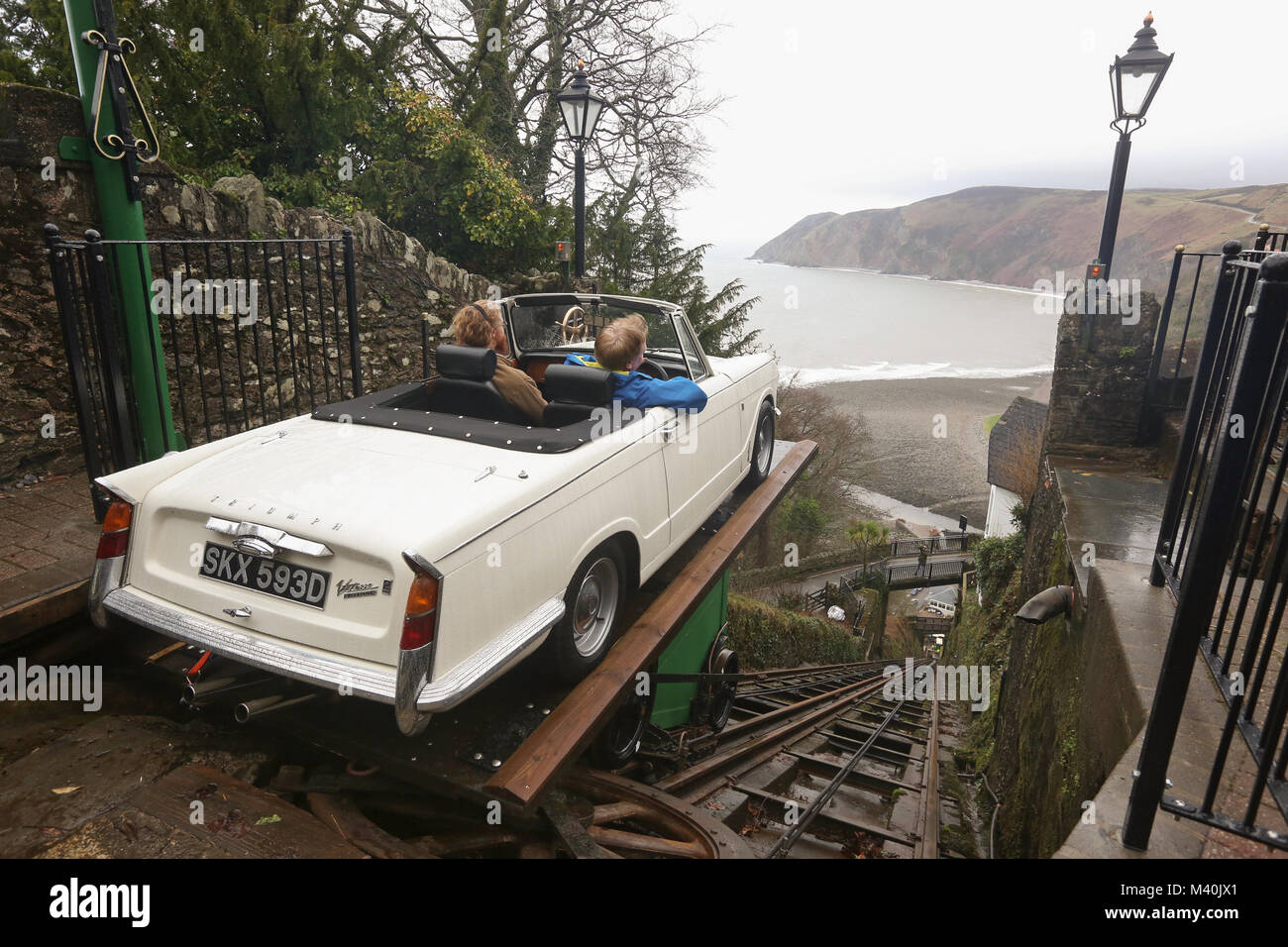 Classic cars ride the Lynton and Lynmouth Cliff Railway in North Devon ...
