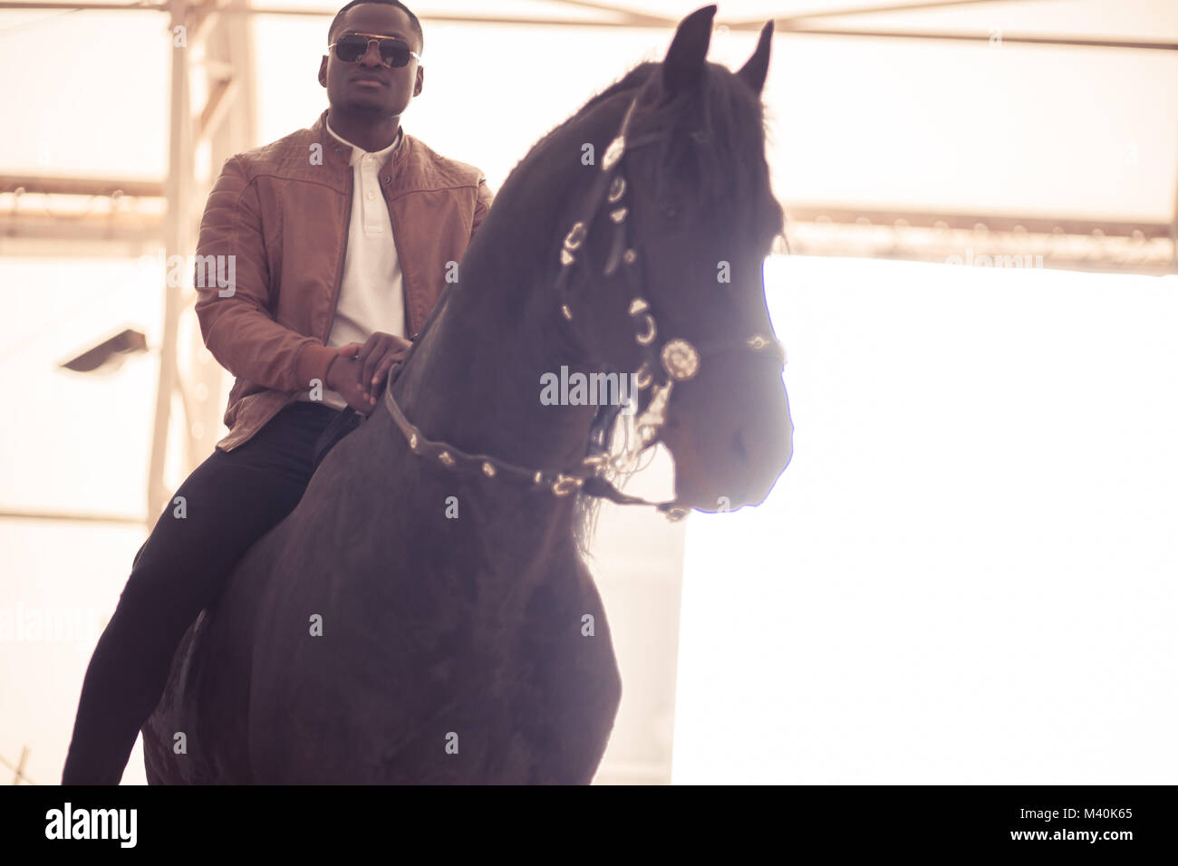 Boy riding hobby horse hi-res stock photography and images - Alamy