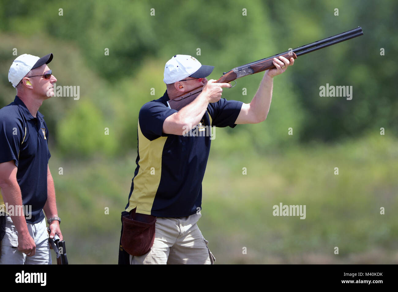 Army Maj. Dave Guida, a member of the Army Skeet Team, shoots during ...