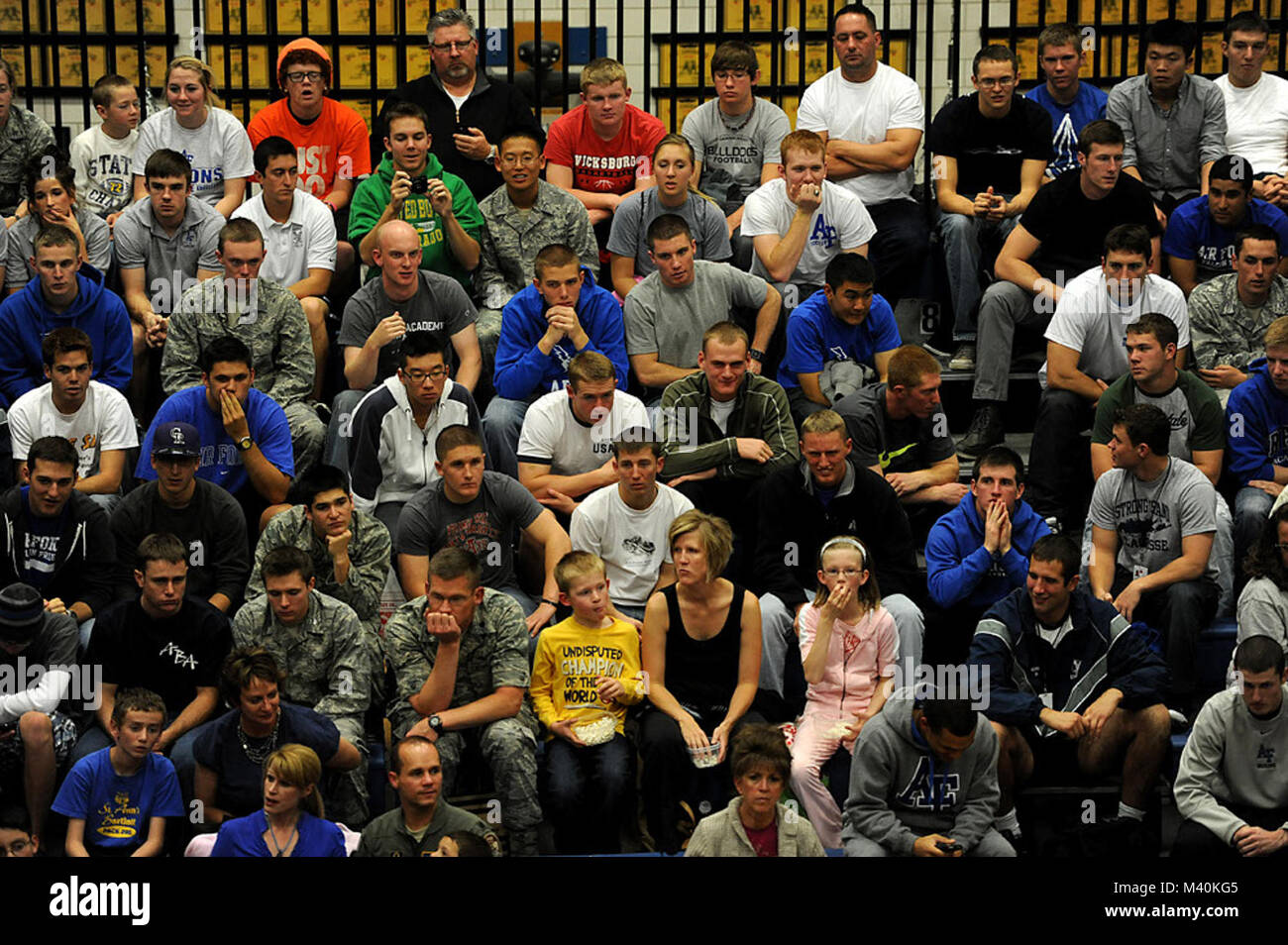 U.S. Air Force Academy boxing team fans sit in the stands quite while ...