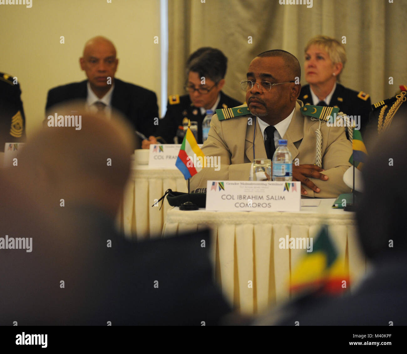 Col. Ibrahim Salim from Comoros (center) listens to a speech from ...