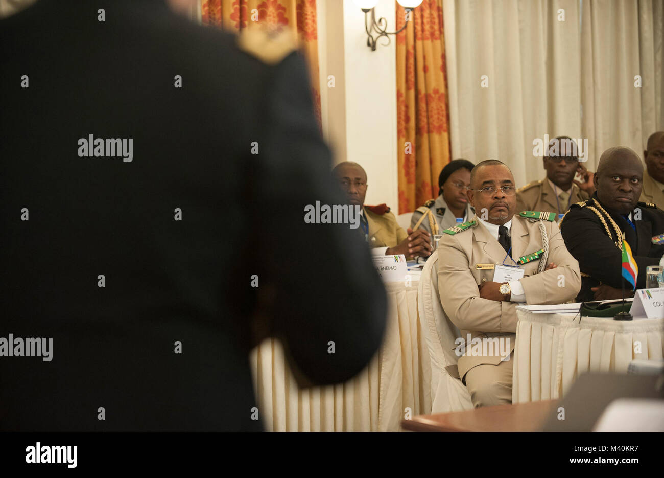 Col. Ibrahim Salim from Comoros (center right) listens to a speech from ...