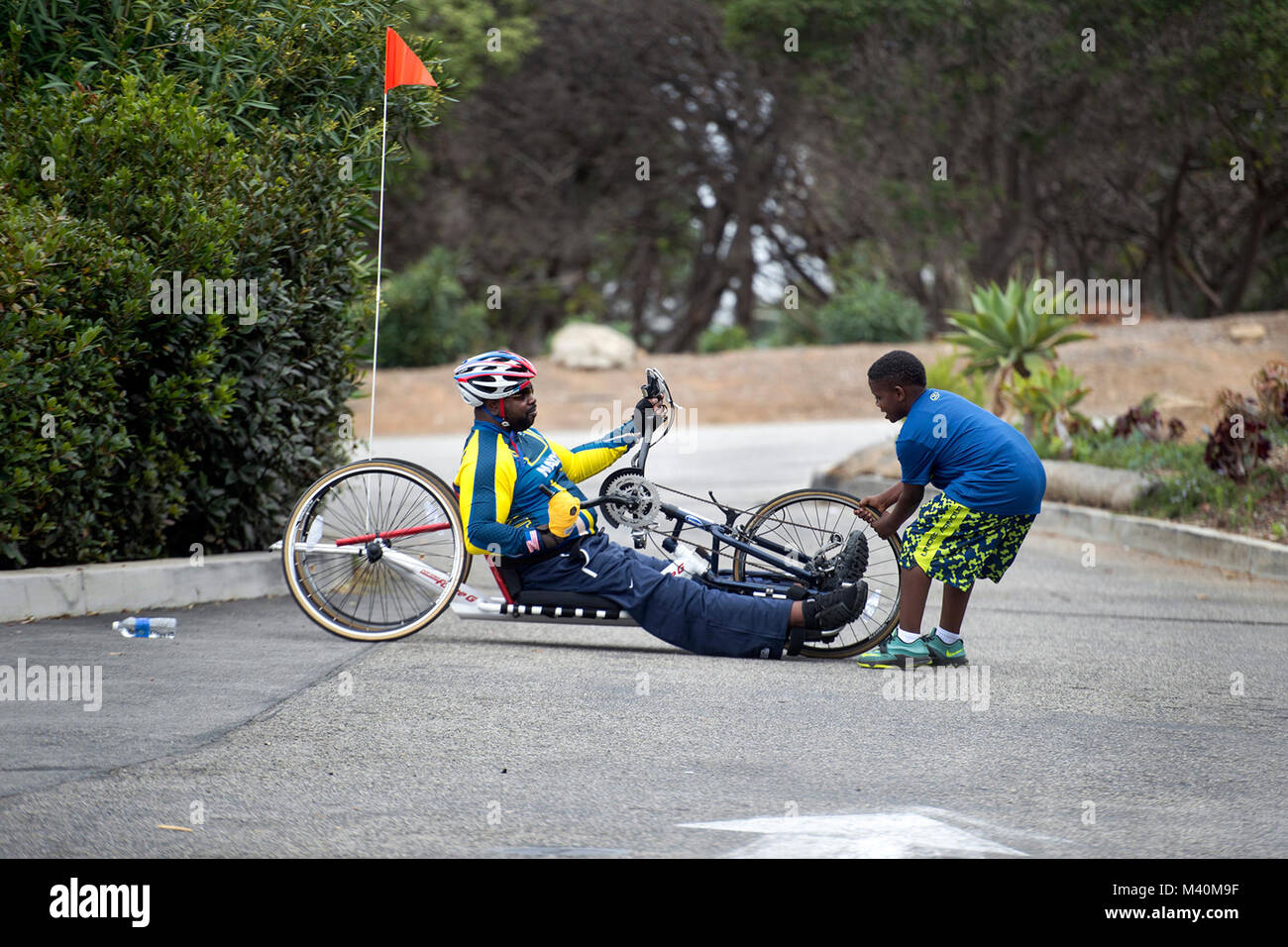 Quintin Johnson, 9, helps his father Coast Guard Lt. Sancho Johnson out ...