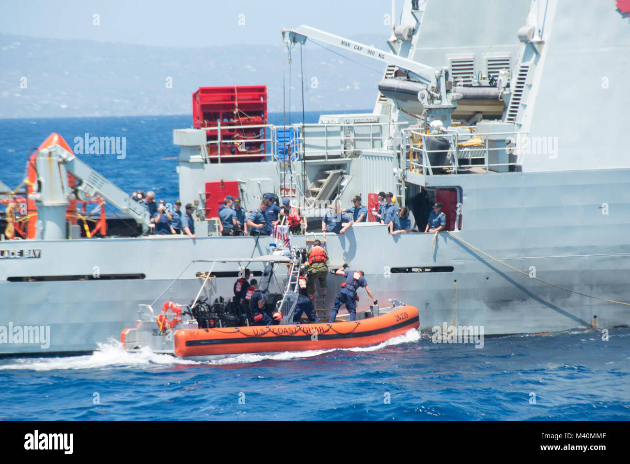 Canadian Forces Master Cpl. Chelsey Hutson climbs down a Jacobs ladder ...