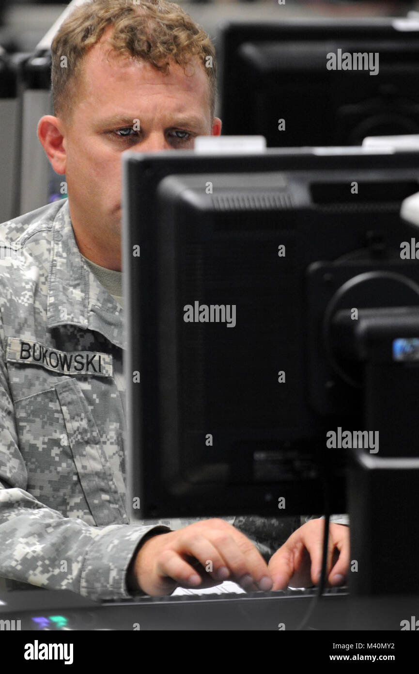 With eyes on monitor, personnel concentrate on exercise scenarios ...