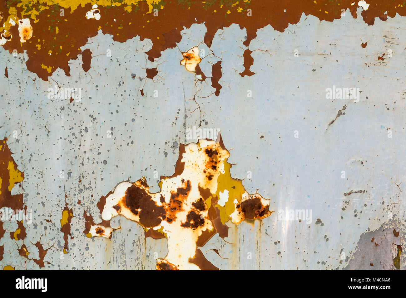 Abstract background texture of vertical grungy rusting metal plate with ...