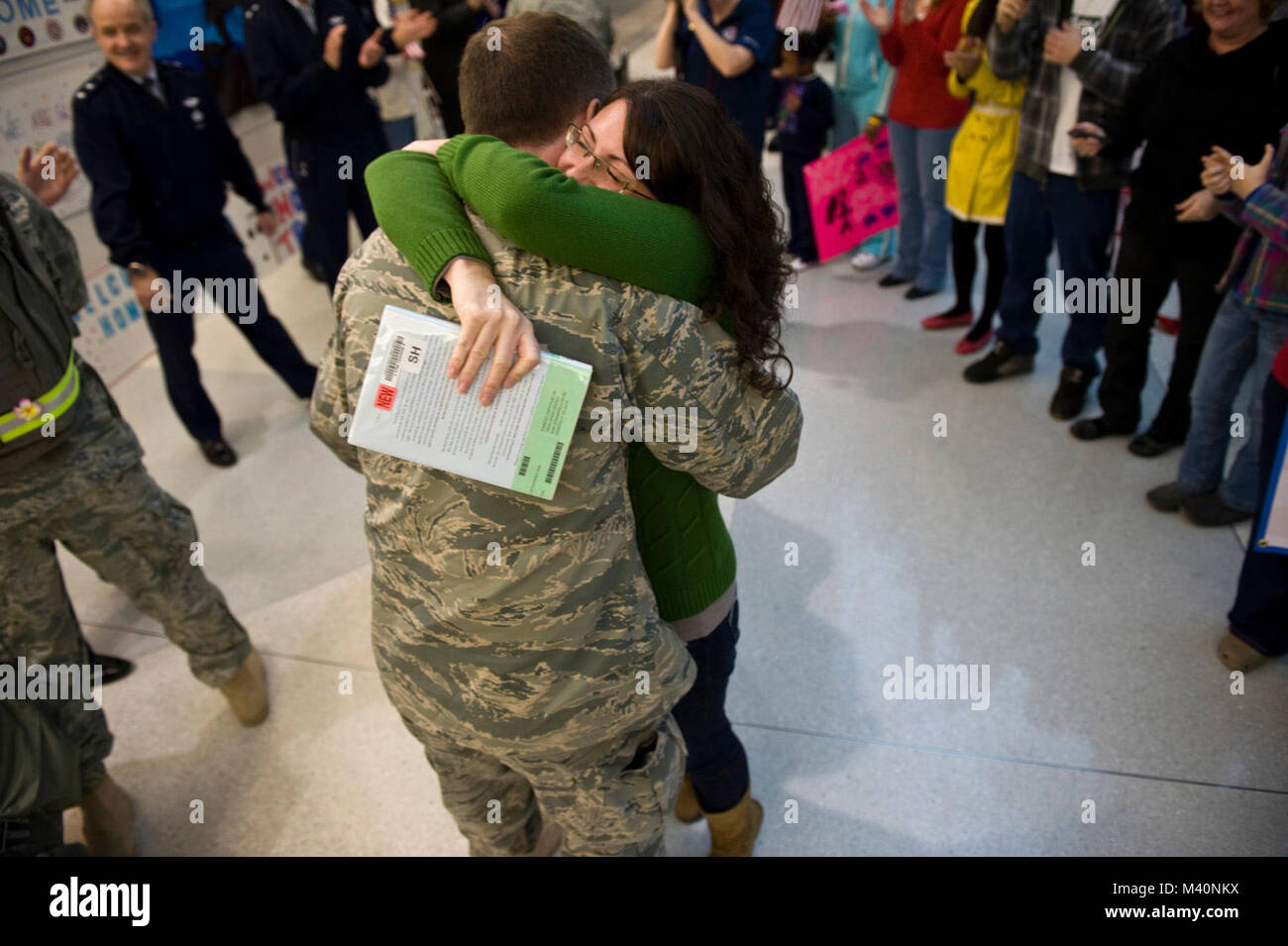 A husband and wife embrace each other after a six-month separation. (U ...