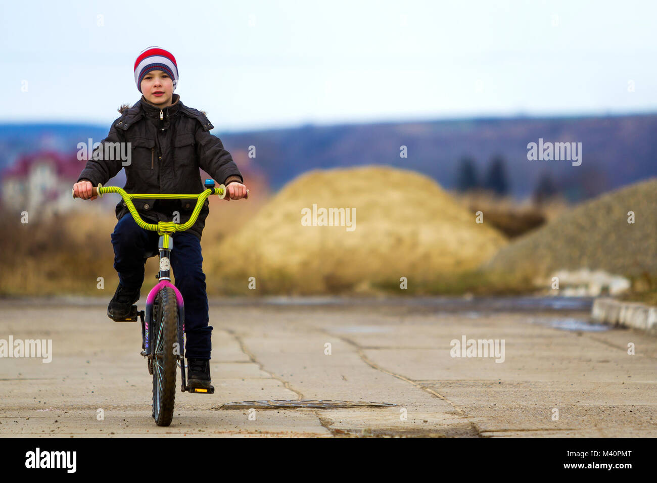 Little boy riding his bicycle in park outdoors Stock Photo - Alamy