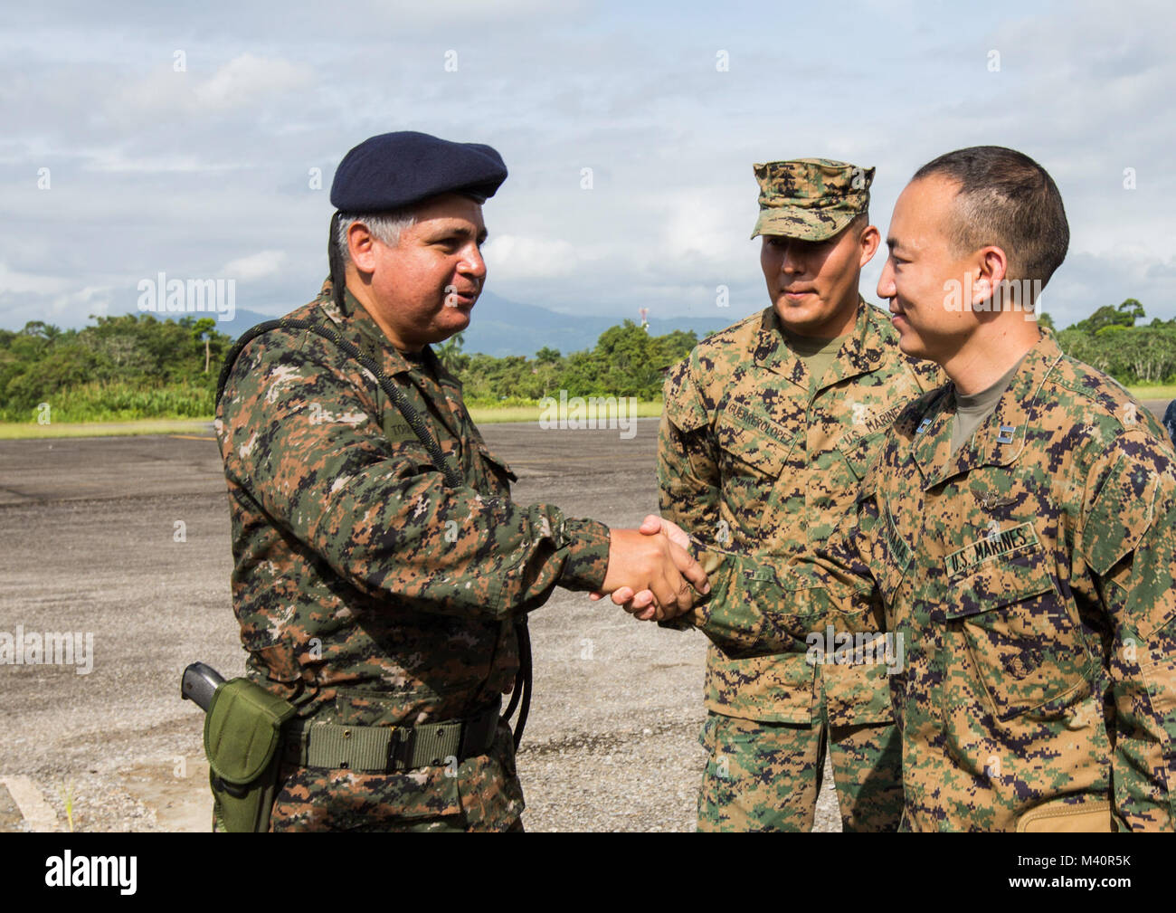 U.S. Marine Corps Capt. Timothy Sakahara, right, officer in charge ...
