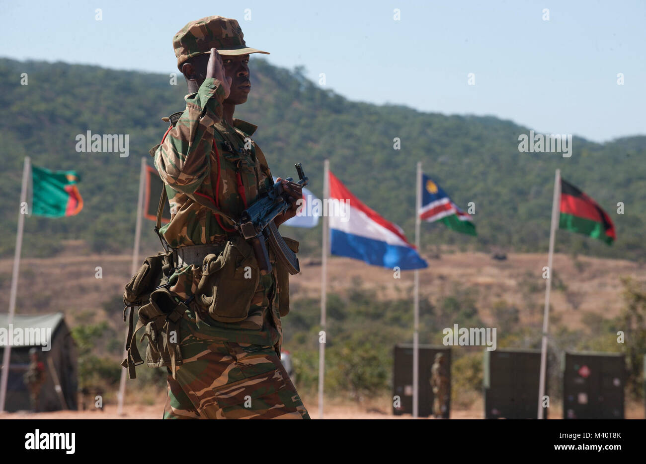 A member of the Zambian Defense Force salutes dignitaries during the ...
