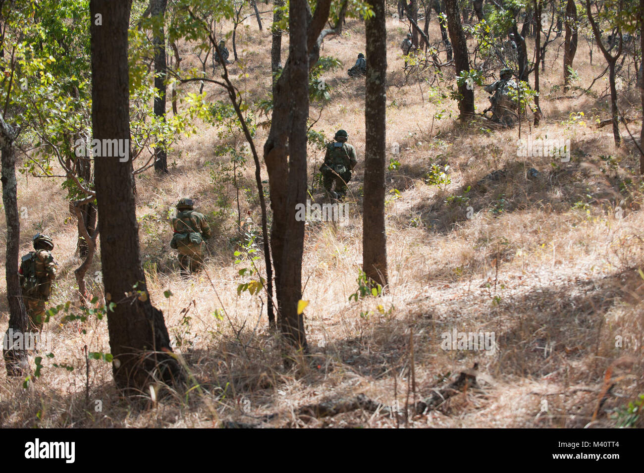 A member of the Zambian Defense Force moves alongside United States ...