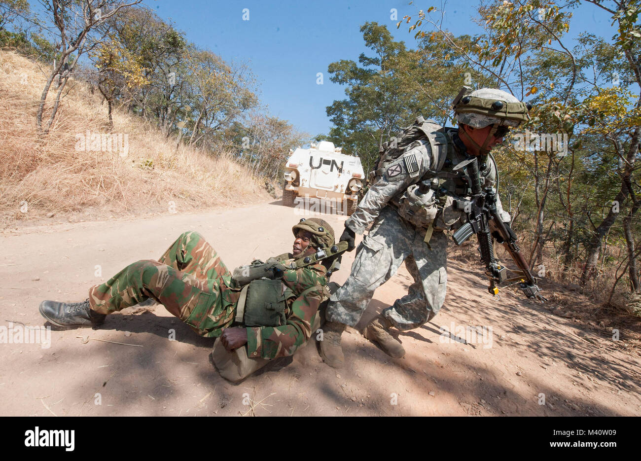 An U.S. Army Soldiers pulls a simulated wounded member of the Zambian ...