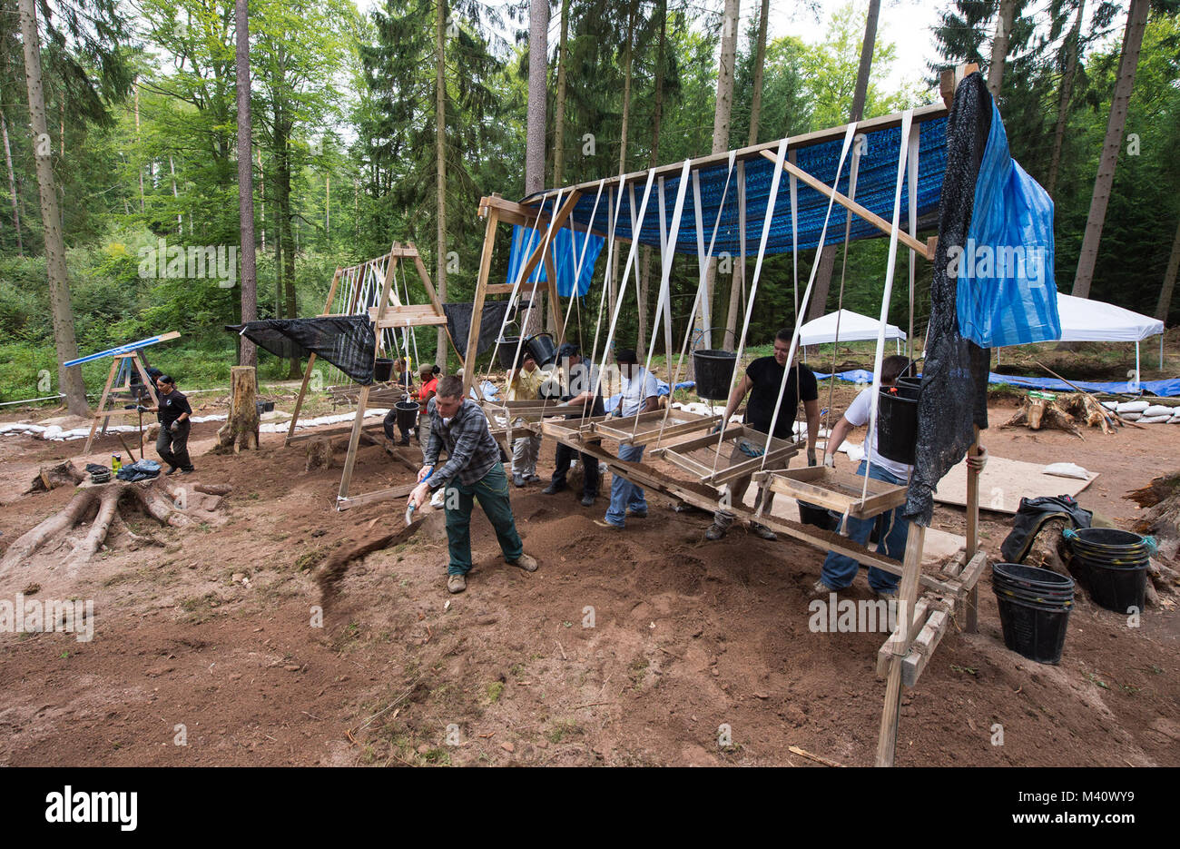 Members of a Defense POW/MIA Accounting Agency (DPAA) recovery team ...