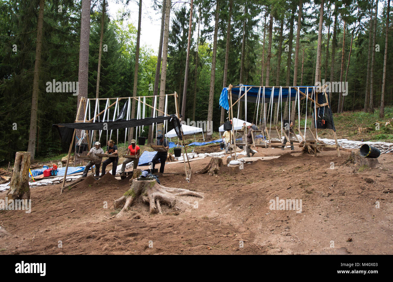 Members of a Defense POW/MIA Accounting Agency (DPAA) recovery team ...