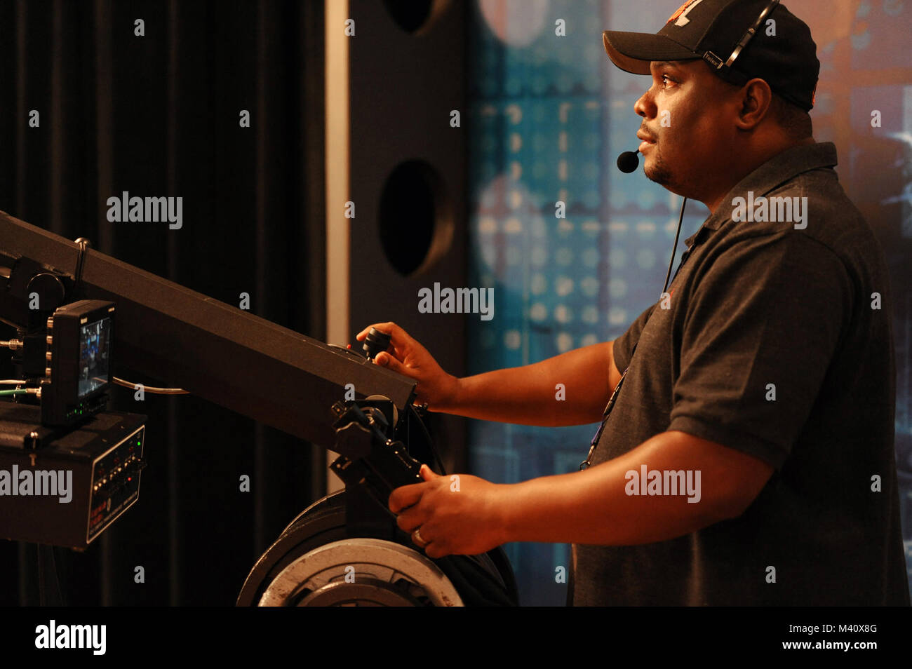 Defense Media Activity (DMA) Jib Operator, Sean Galloway, operates Jib ...