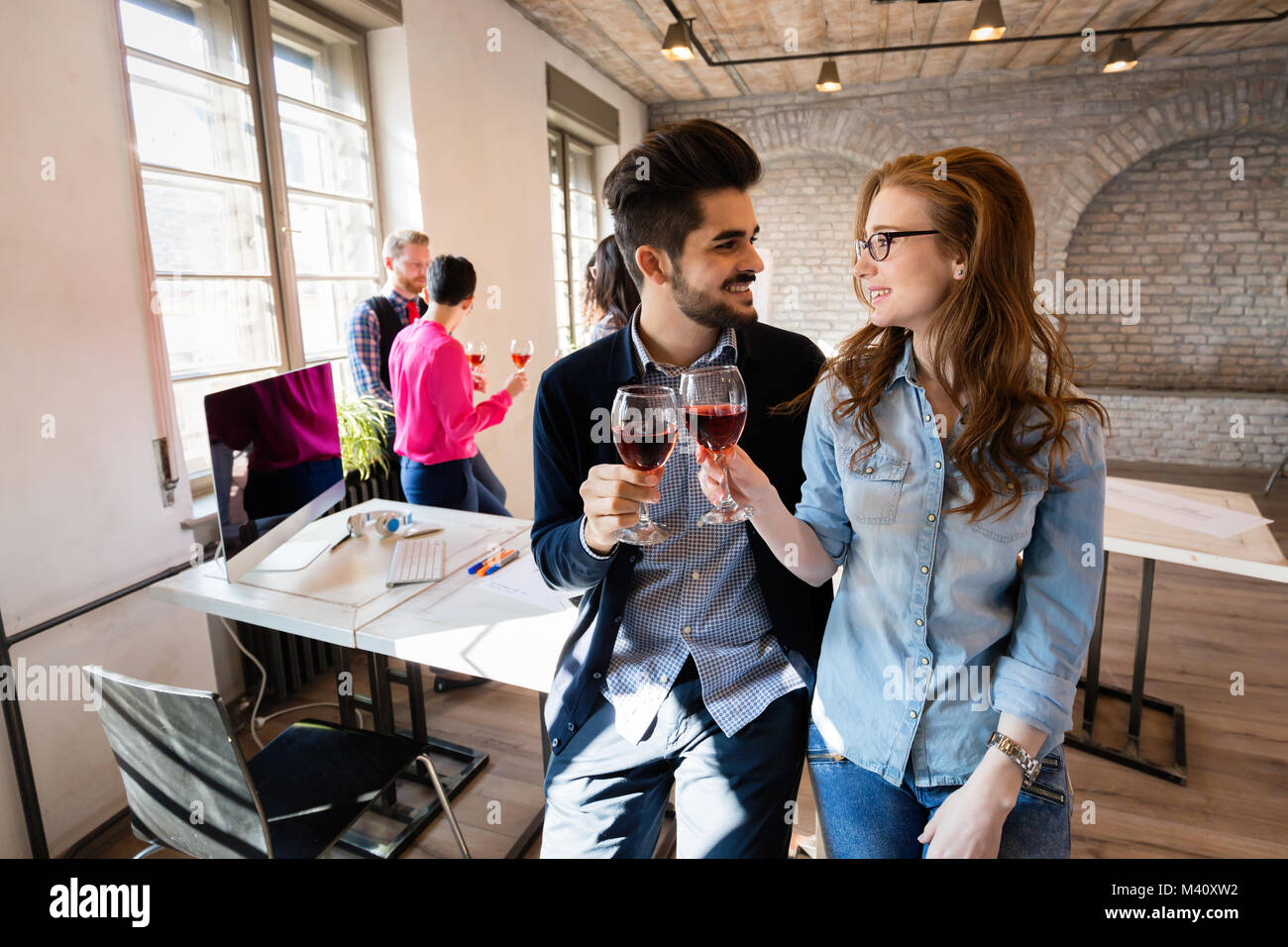 Group of successful architects celebrating in office Stock Photo - Alamy
