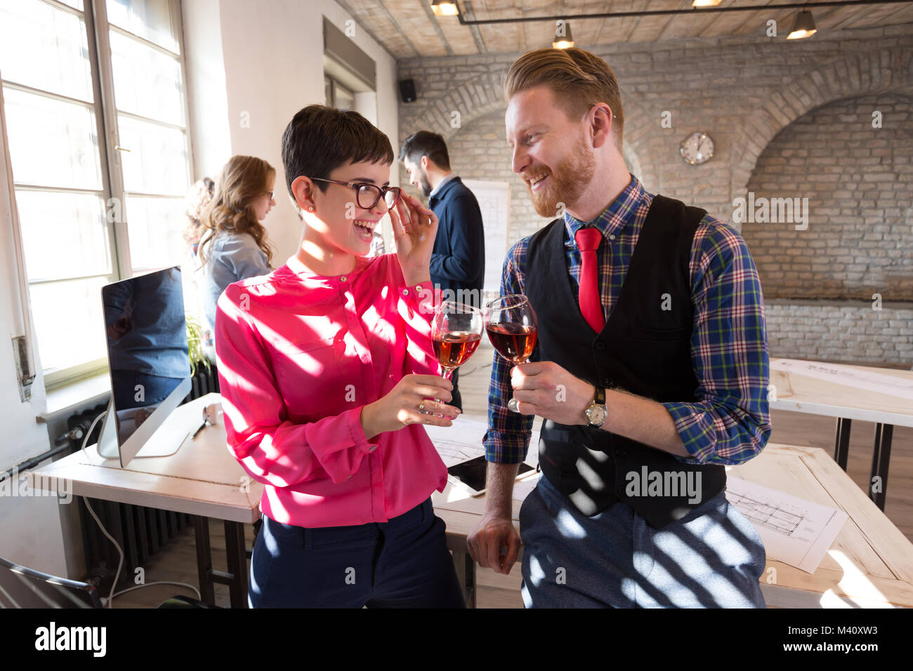 Group of successful architects celebrating in office Stock Photo - Alamy