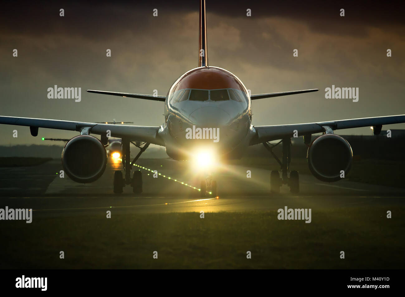 An Easyjet passenger plane taxiing out to the runway for take off at ...