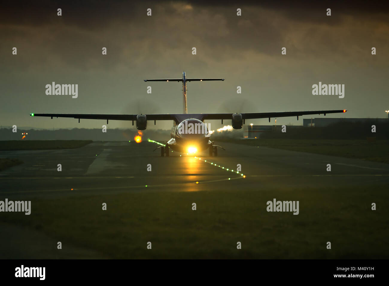 A passenger jet taxiing out to the runway for take off at Liverpool ...
