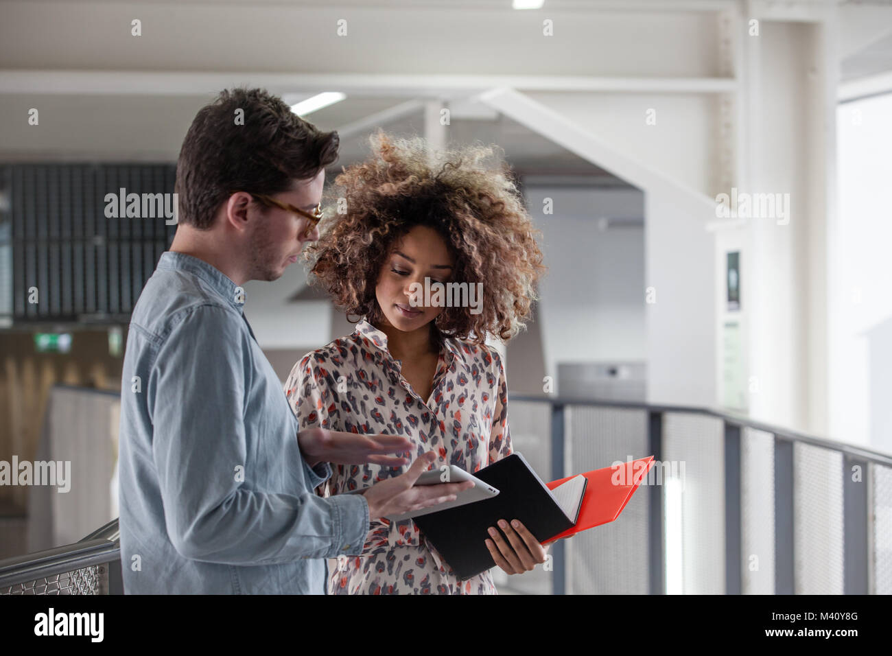 Colleagues working together digital tablet hi-res stock photography and ...