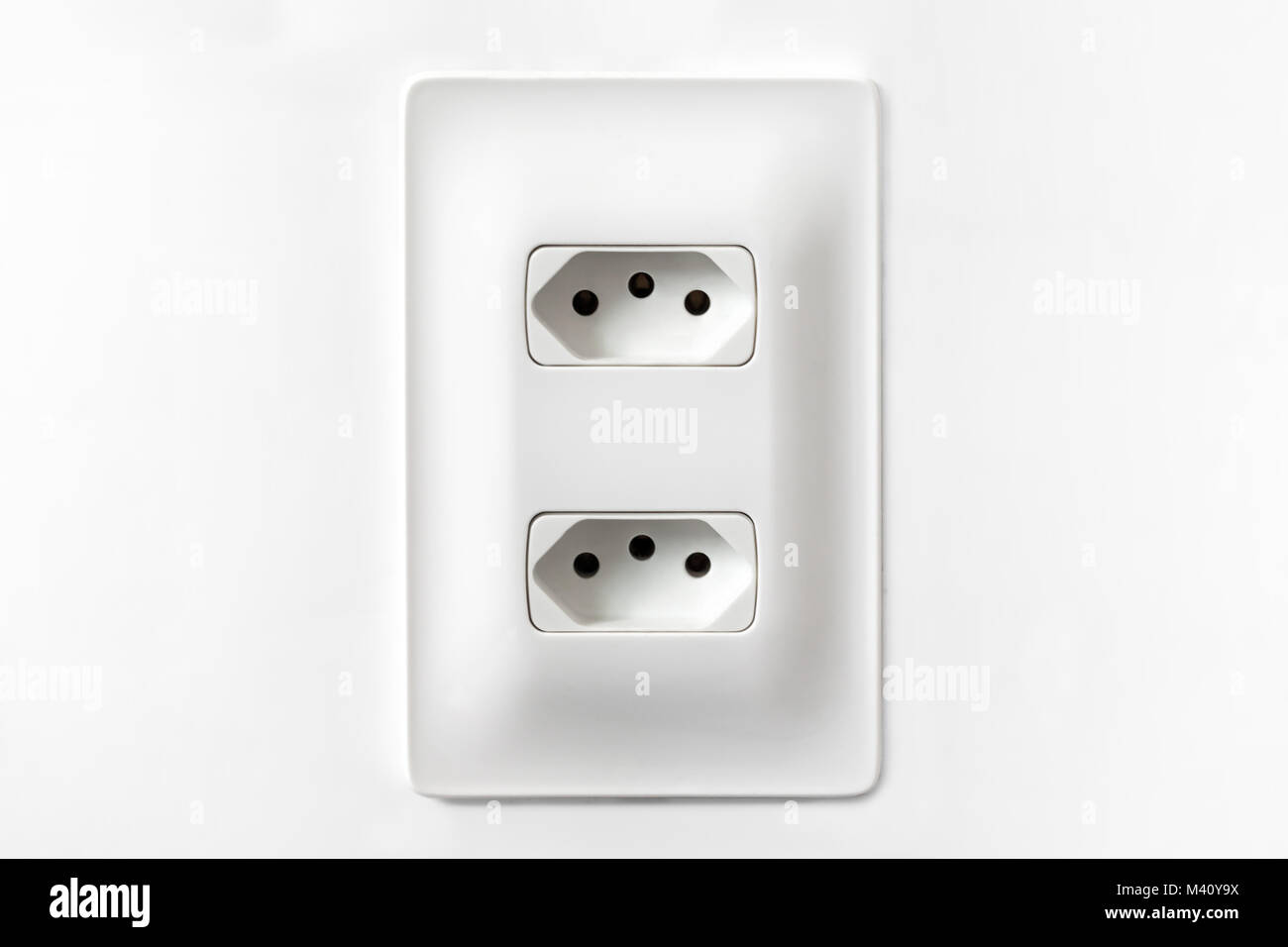 Double plug socket on the wall isolated on white background Stock Photo ...