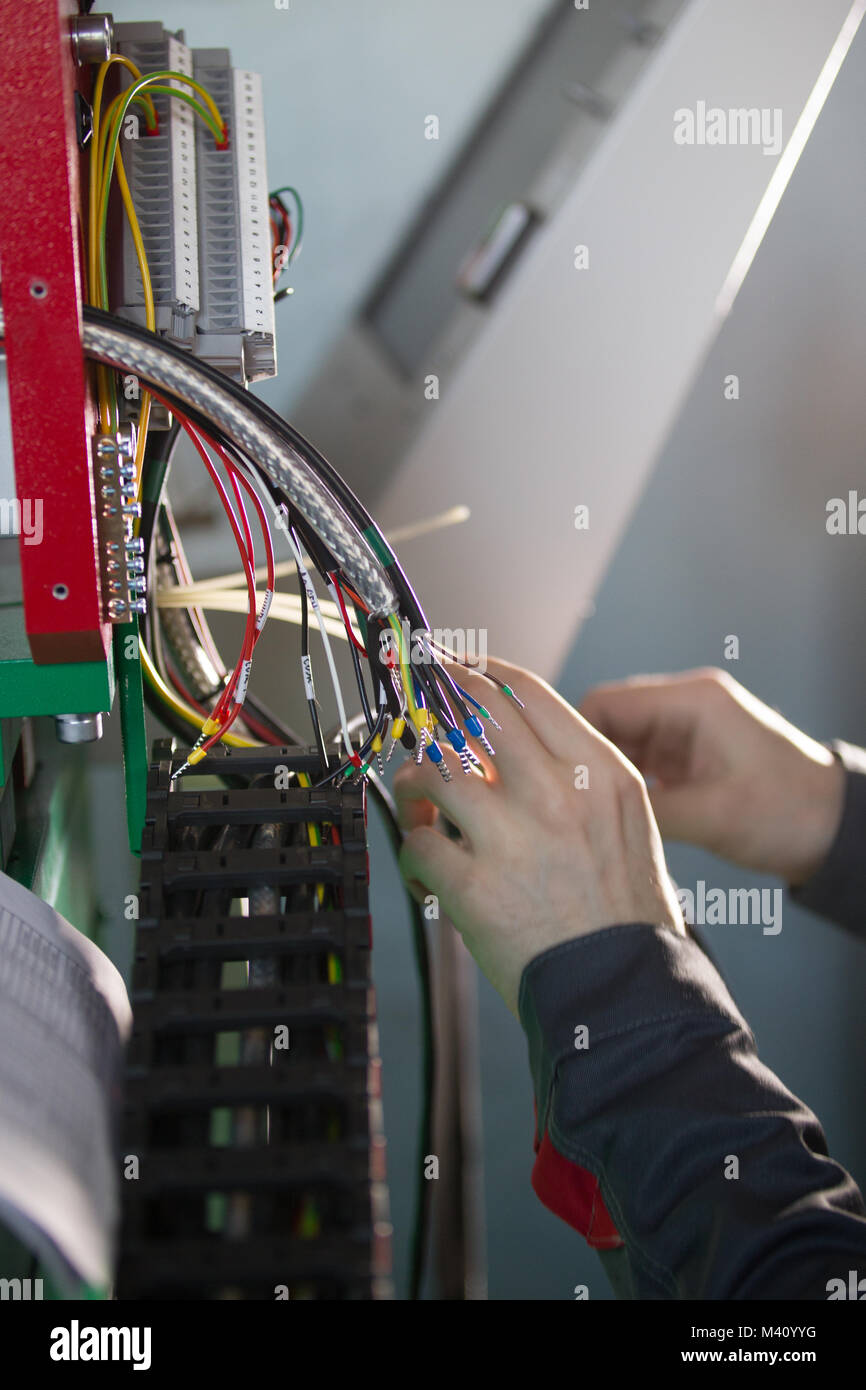 Hands of electrician engineer switching and testing equipment Stock ...