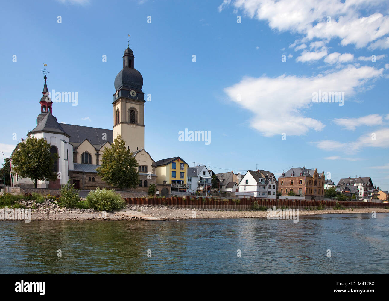 Catholic parish church Saint Peter at riverbank of Rhine river ...