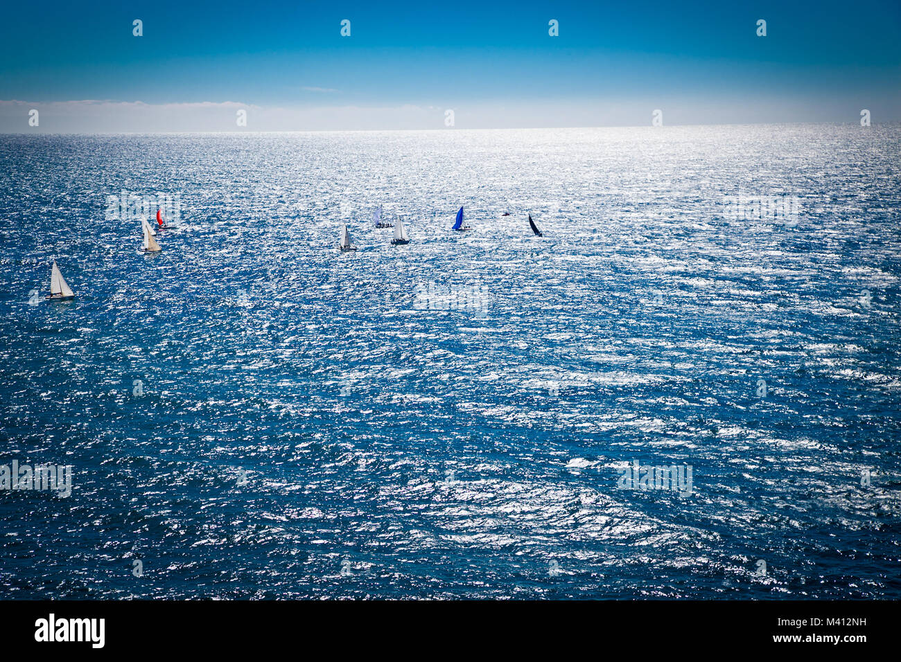 Azur blue sea with sailboats in sunset. Azur coast Stock Photo - Alamy