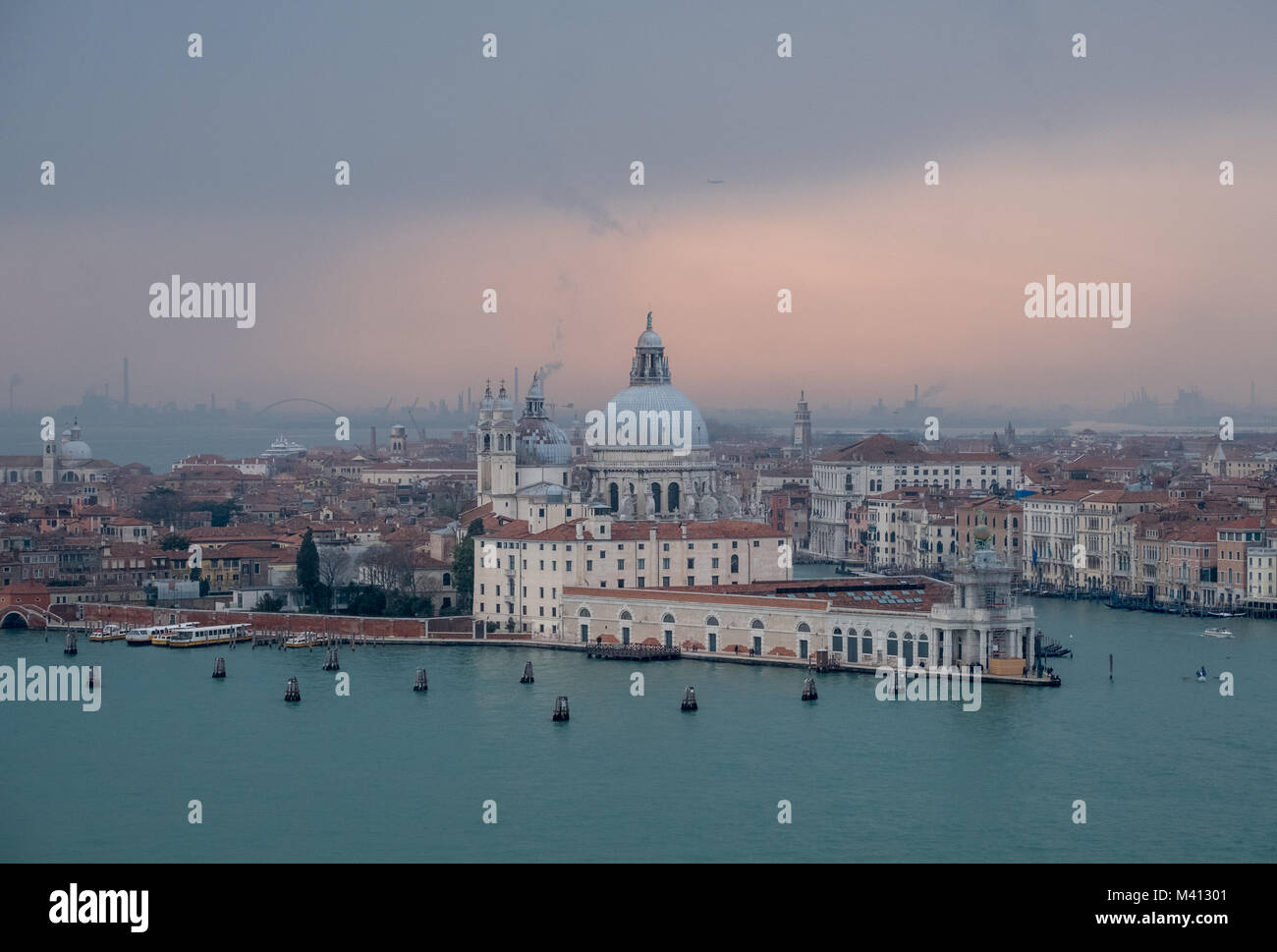 View of Venice skyline at dusk on a clear day showing the Basilica di ...