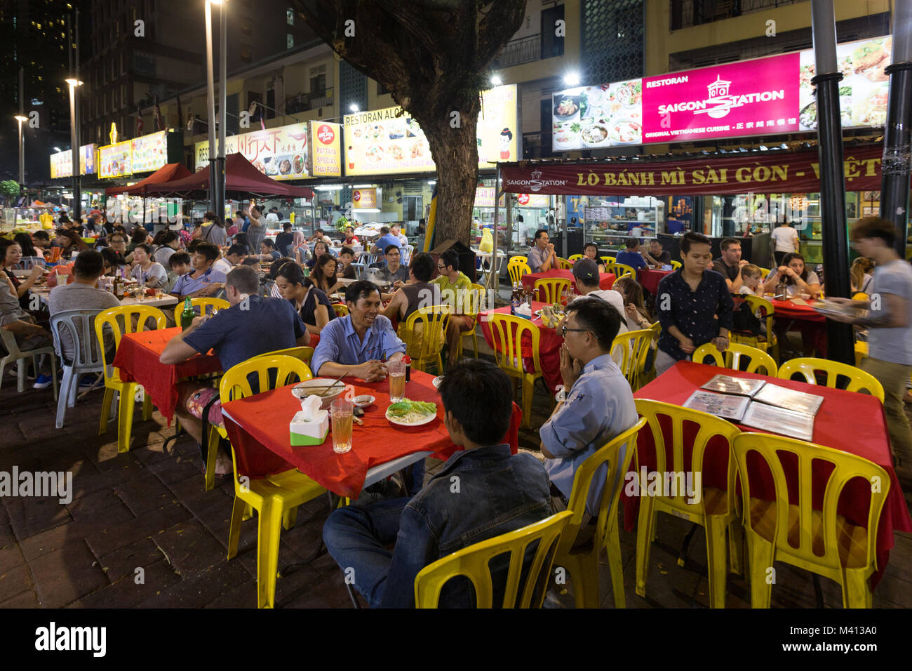 Kuala Lumpur, Malaysia - December 22 2017: Tourists and locals eating ...