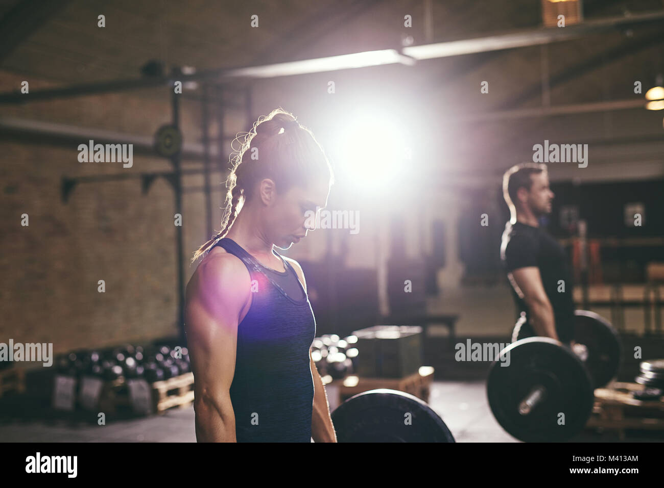People holding heavy barbells in gym. Horizontal indoors shot Stock ...