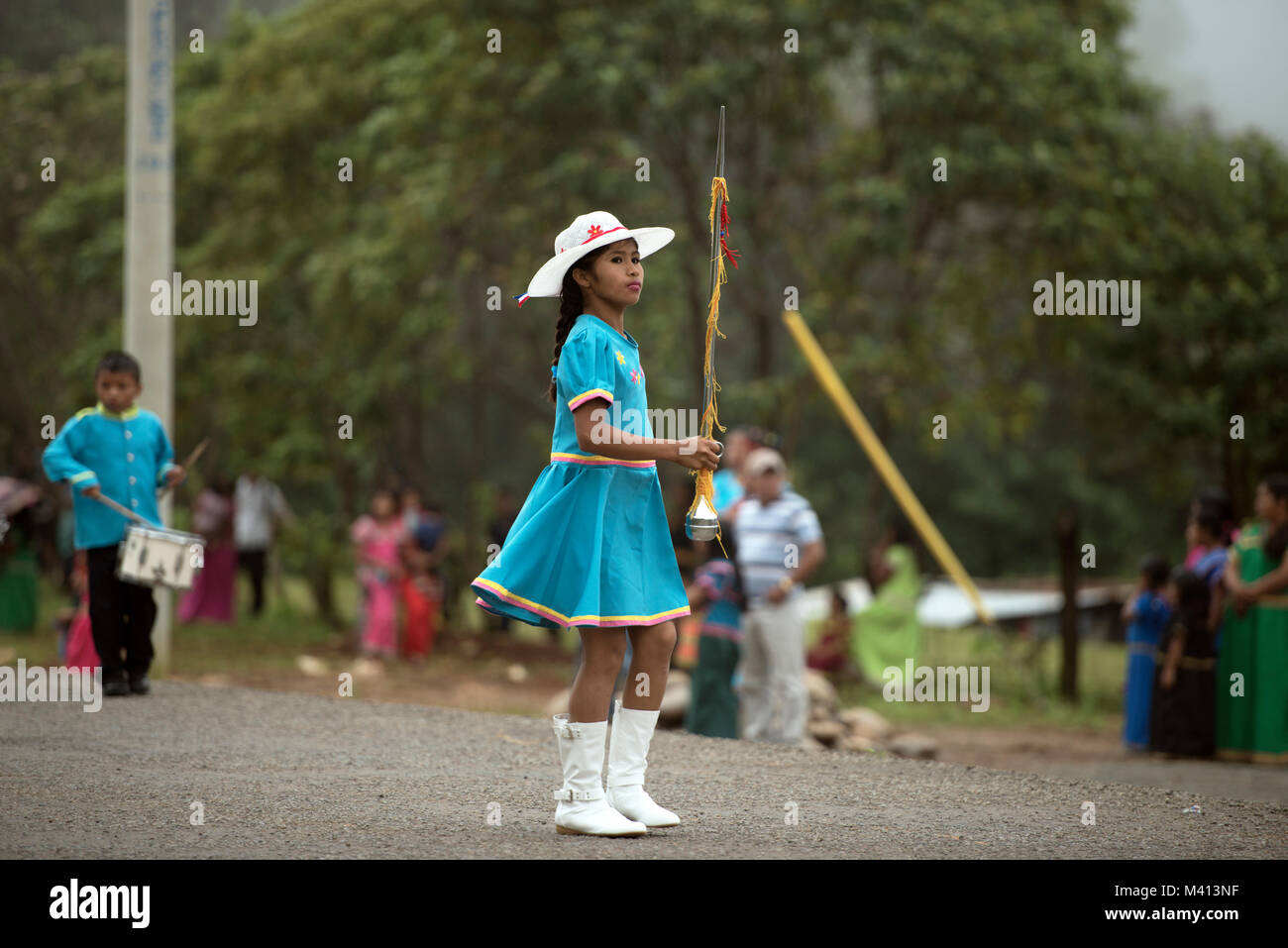 A young Ngäbe-Bugle girl leads her marching band on a parade through ...