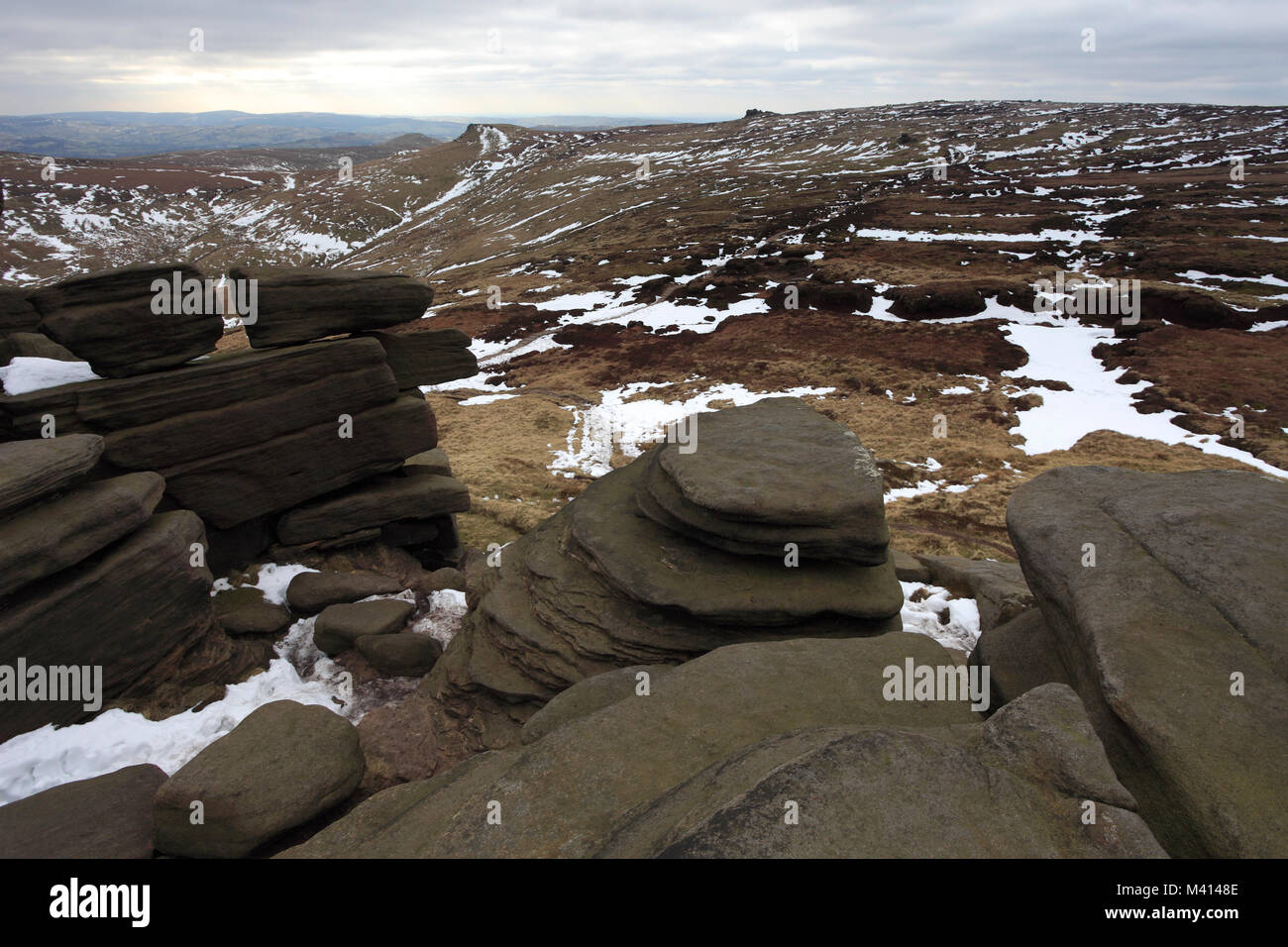 Winter snow on the Woolpacks rocks, Kinder scout, Peak District ...