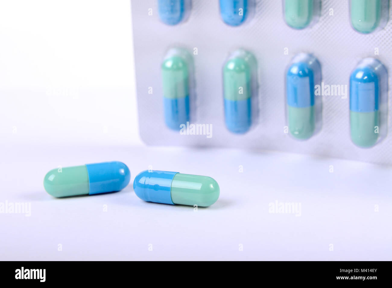 Capsules and pills container Stock Photo - Alamy