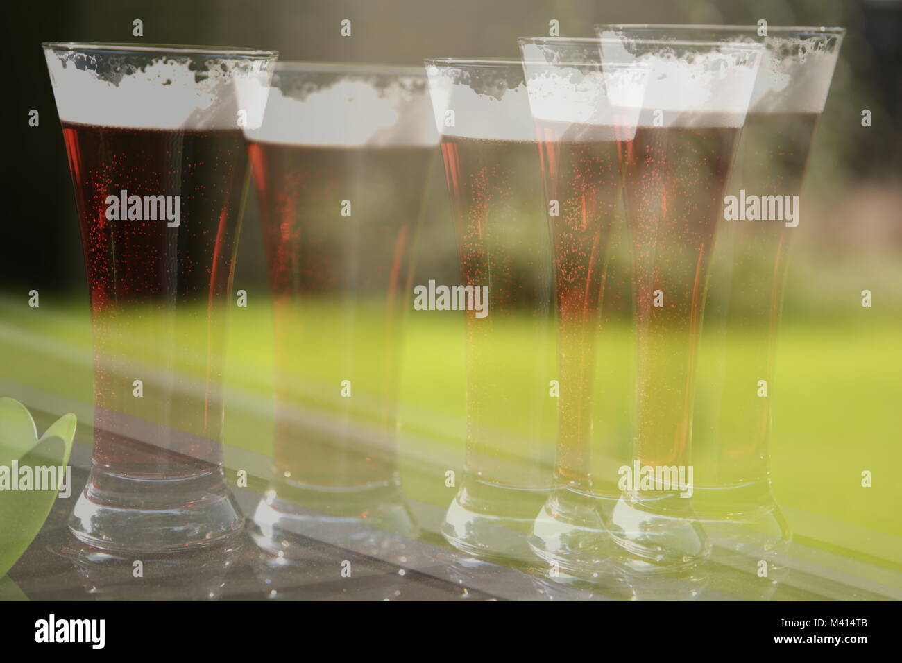 A glass of rose beer in double exposure Stock Photo - Alamy