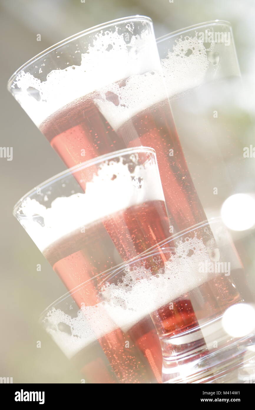 A glass of rose beer in double exposure Stock Photo - Alamy