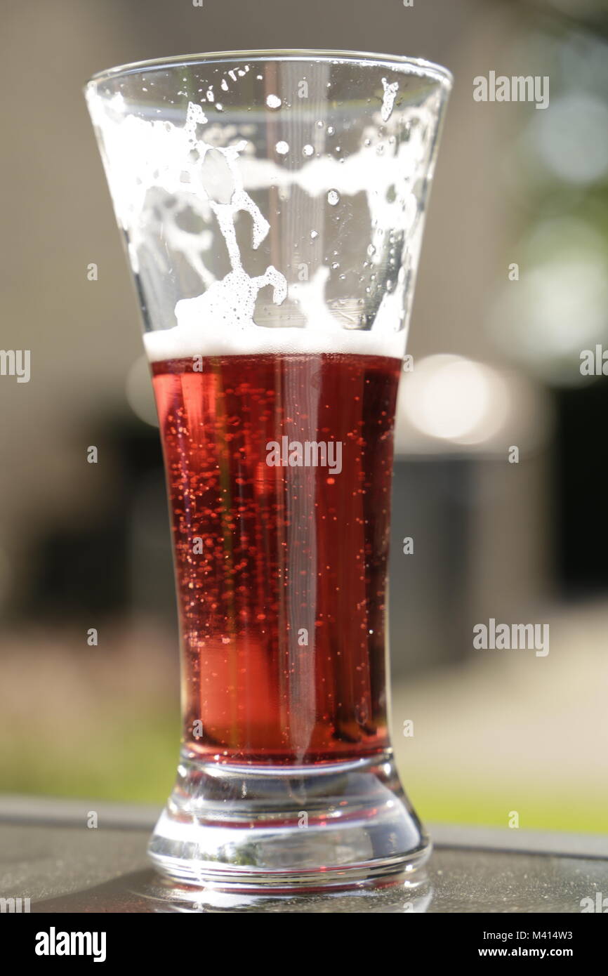 A glass of refreshing rose beer Stock Photo - Alamy